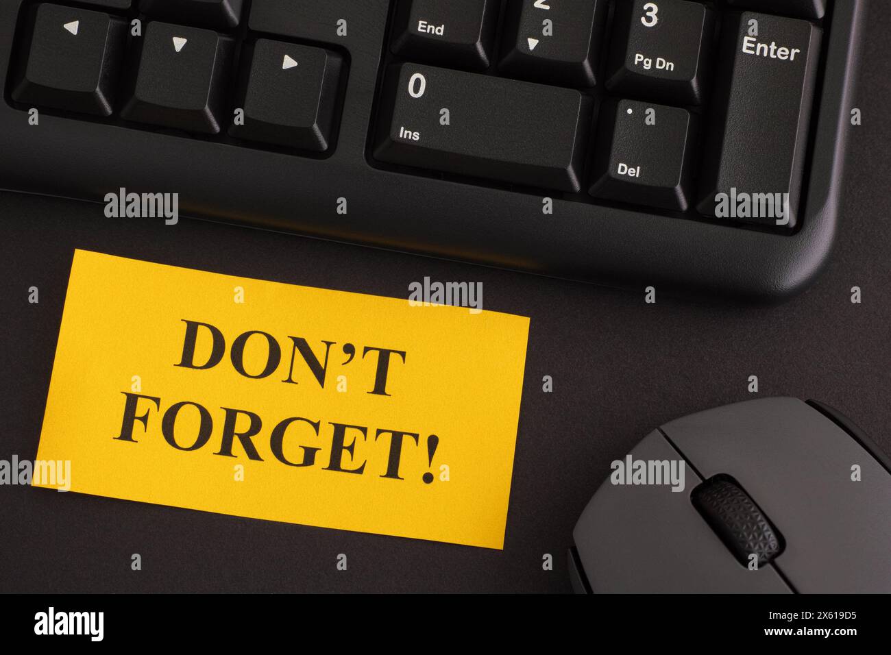 Don't Forget. Paper note with writing Don't Forget on a desk with black ...
