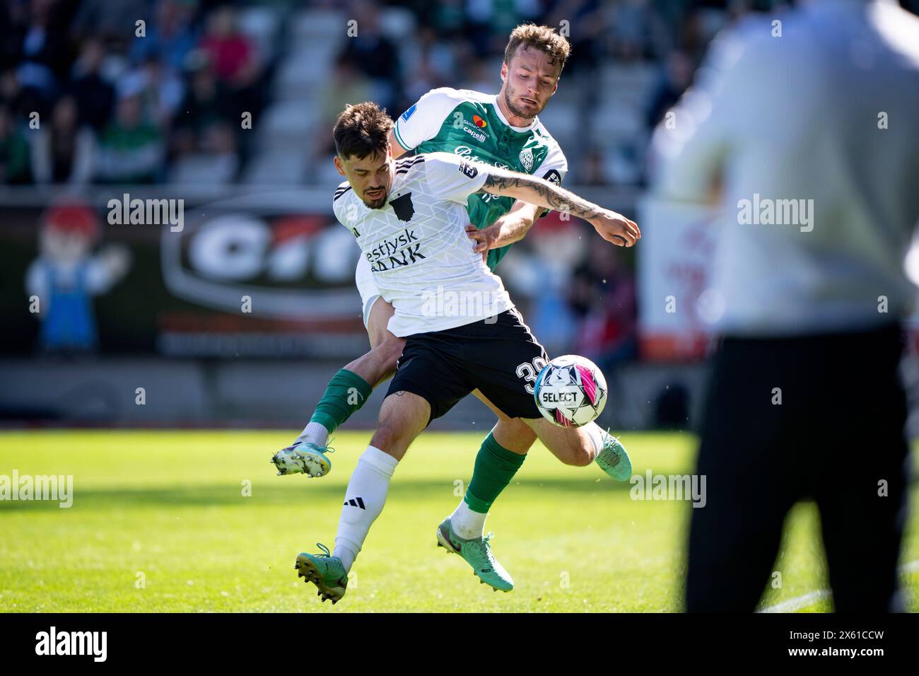 Viborg, Denmark. 12th May, 2024. Vejle's David Colina in battle with ...