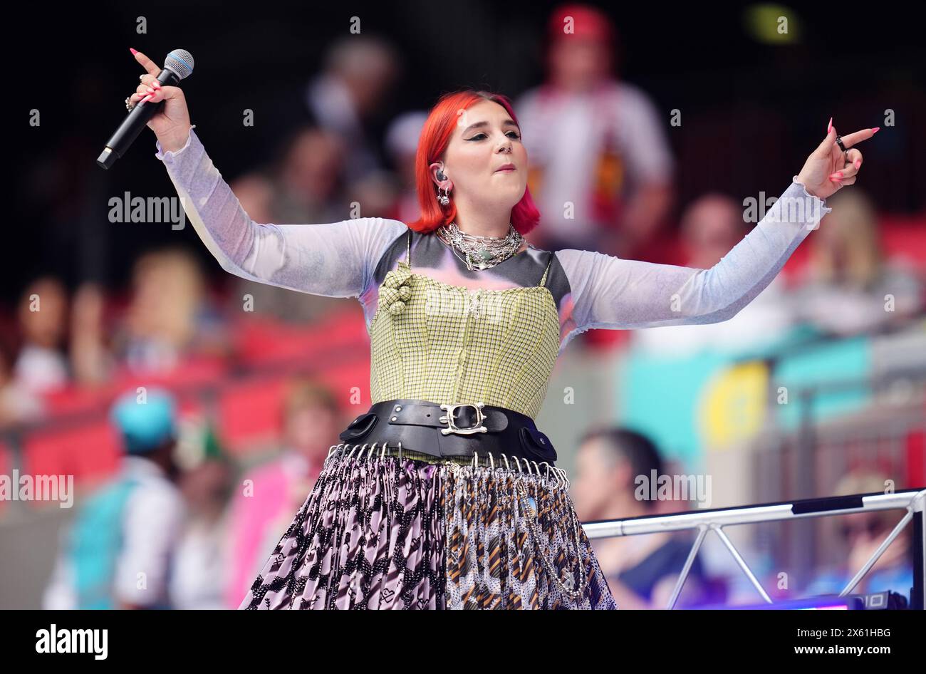 Singer Issey Cross performs ahead of kick off in the Adobe Women's FA ...