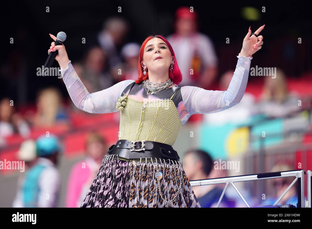 Singer Issey Cross performs ahead of kick off in the Adobe Women's FA ...