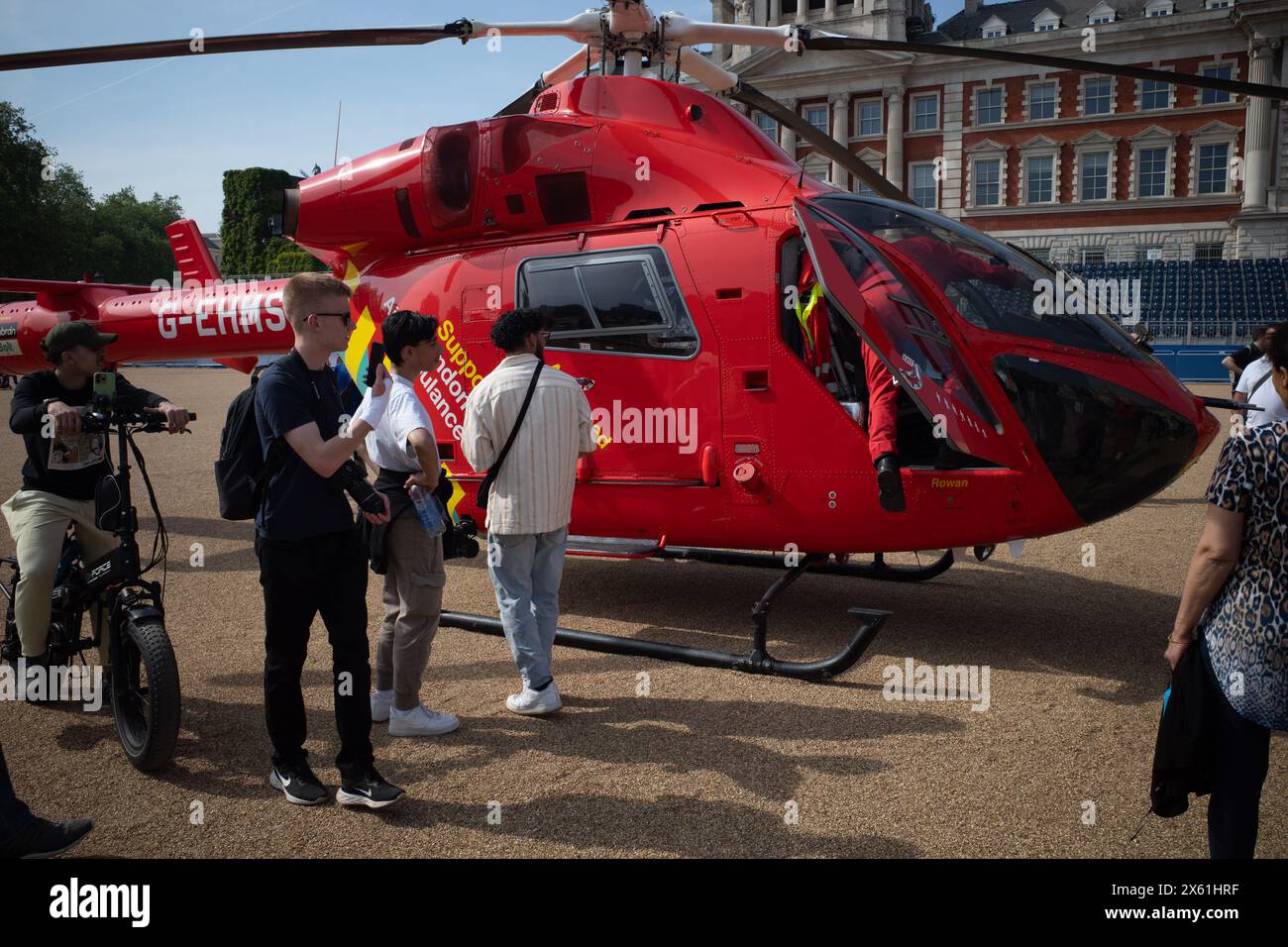 Crowds gather around London's Air Ambulance after landing on Horse ...