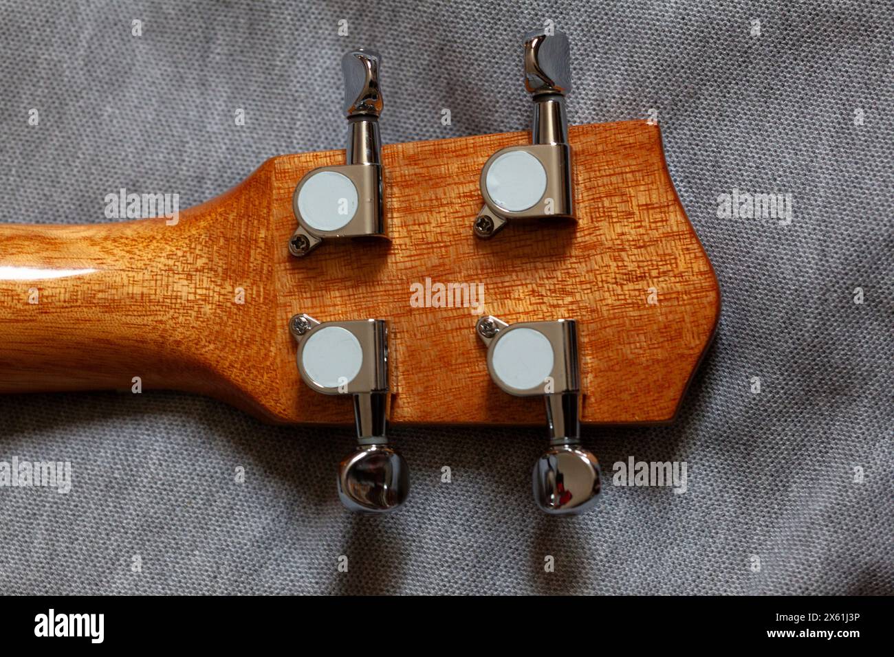 Closed back tuners on a ukulele Stock Photo - Alamy