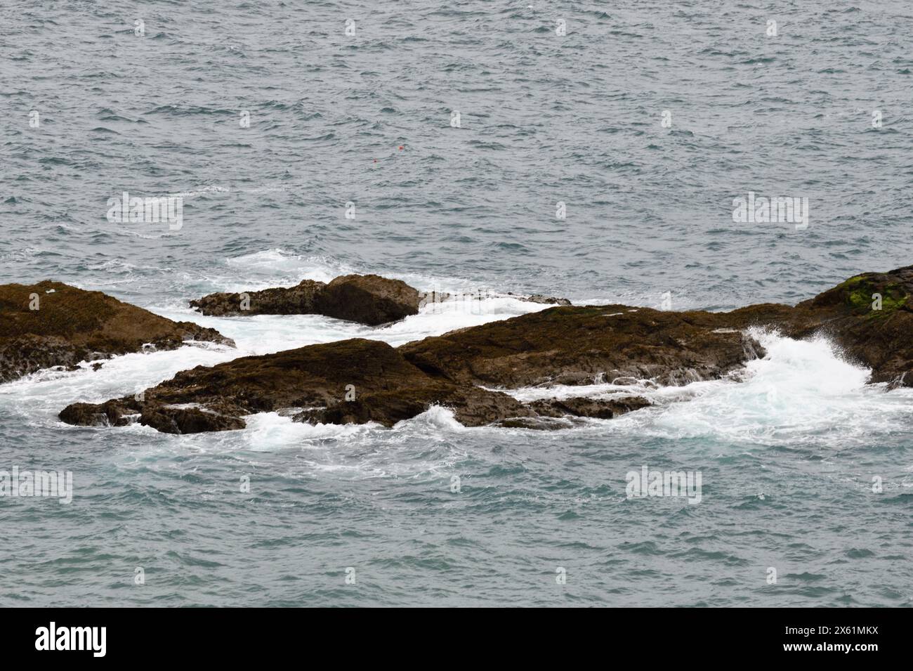 Port Issac Coastline with the Sea breaking on the Rocks Cornwall ...