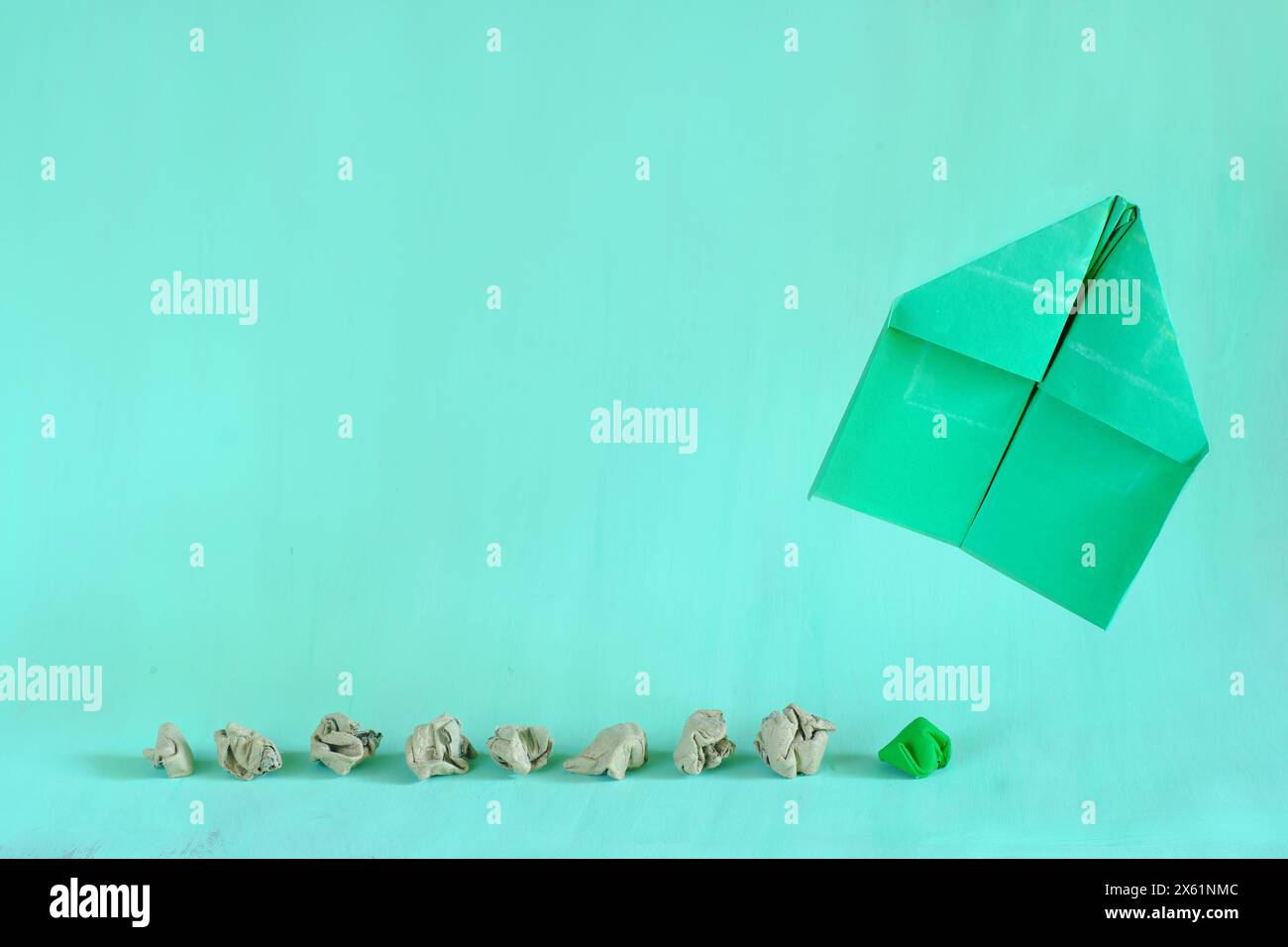 ecological business transformation concept with crumpled paper balls ...