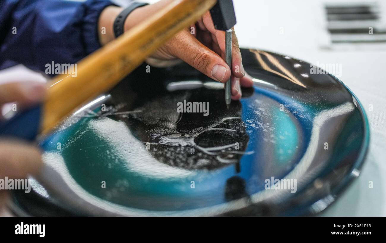 Guiyang, China's Guizhou Province. 8th May, 2024. Chen Yinfu makes an ...