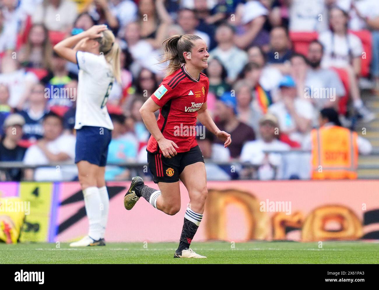 Manchester United's Ella Toone (left) celebrates scoring their side's ...