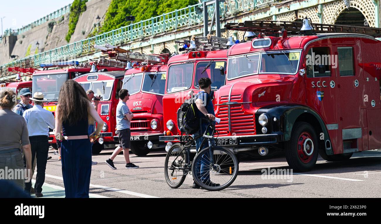 Brighton UK 12th May - A line up of old fire engines on Madeira Drive ...