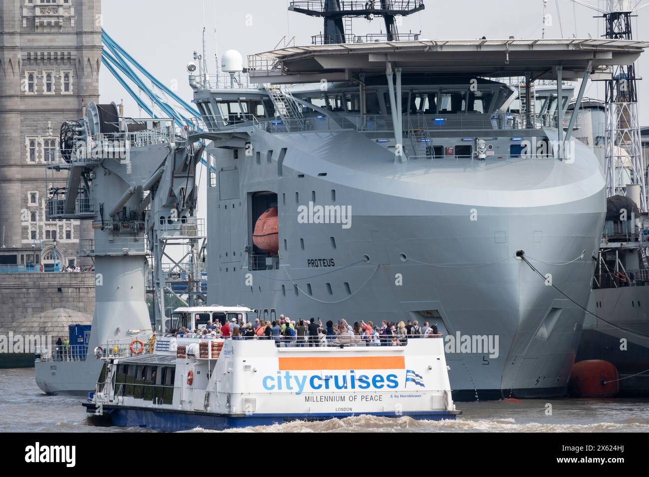 London, UK. 12 May 2024. RFA Proteus is seen moored next to HMS Belfast ...