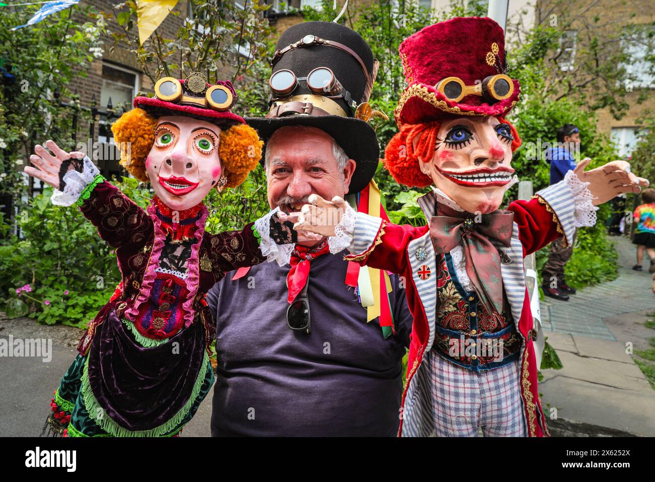London, UK. 12th May, 2024. A puppeteer with two fantastic steam punk ...