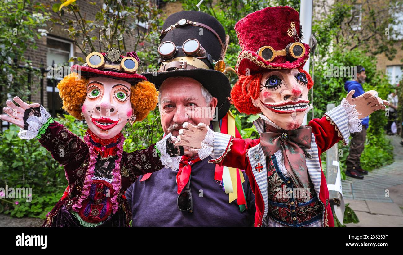 London, UK. 12th May, 2024. A puppeteer with two fantastic steam punk ...