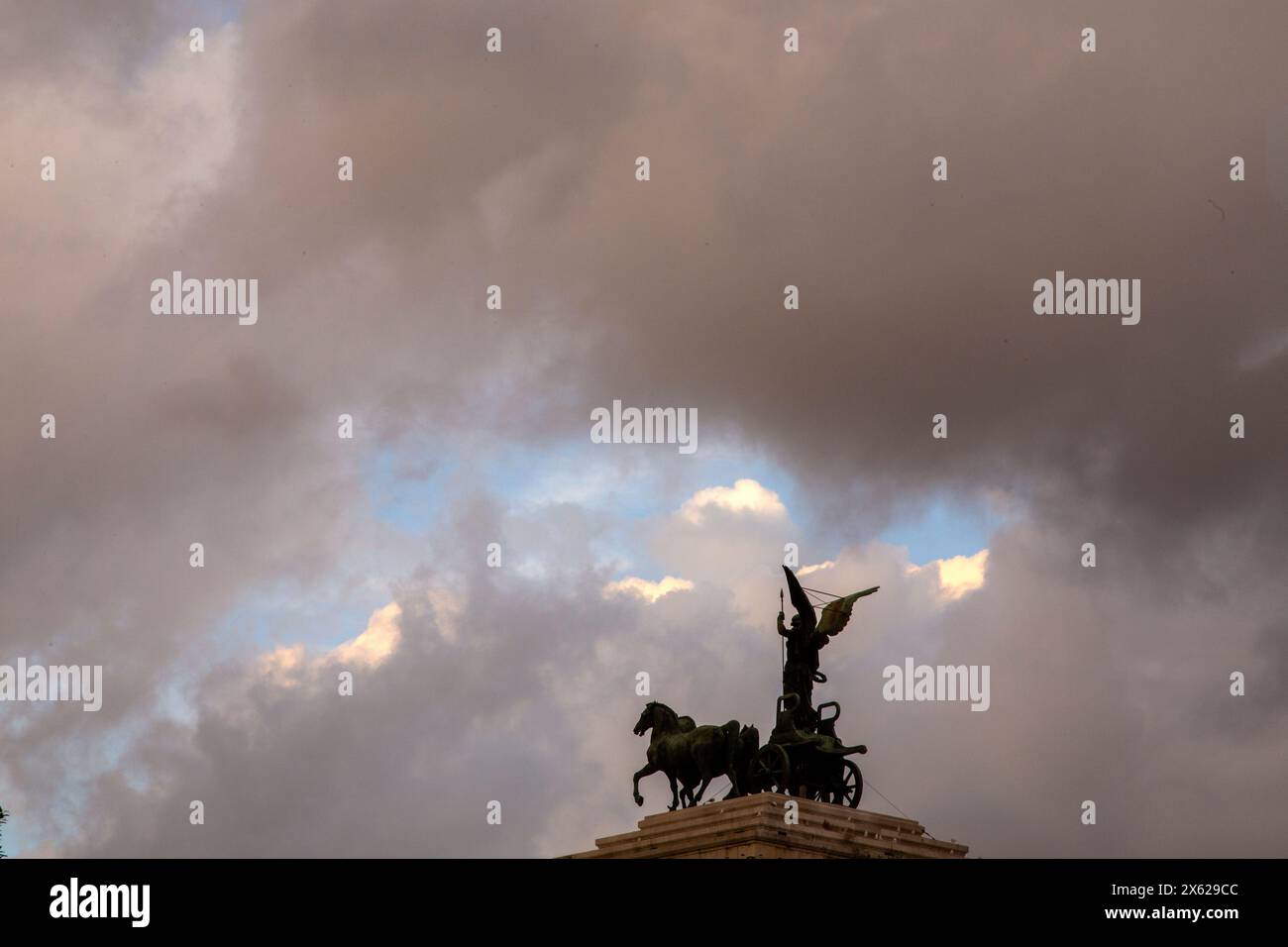 Details, a winged statue on a horse-drawn carriage against the stormy ...
