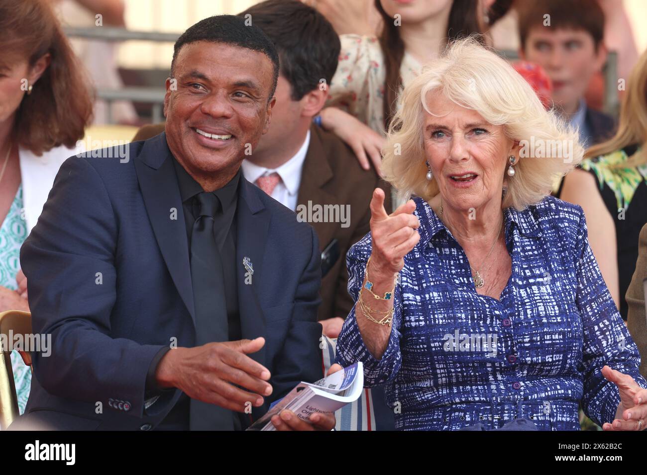 Queen Camilla and William Clements, Vice President of global ...