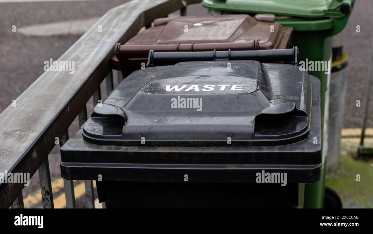 Plastic bins for separate waste close-up on city street Stock Photo - Alamy