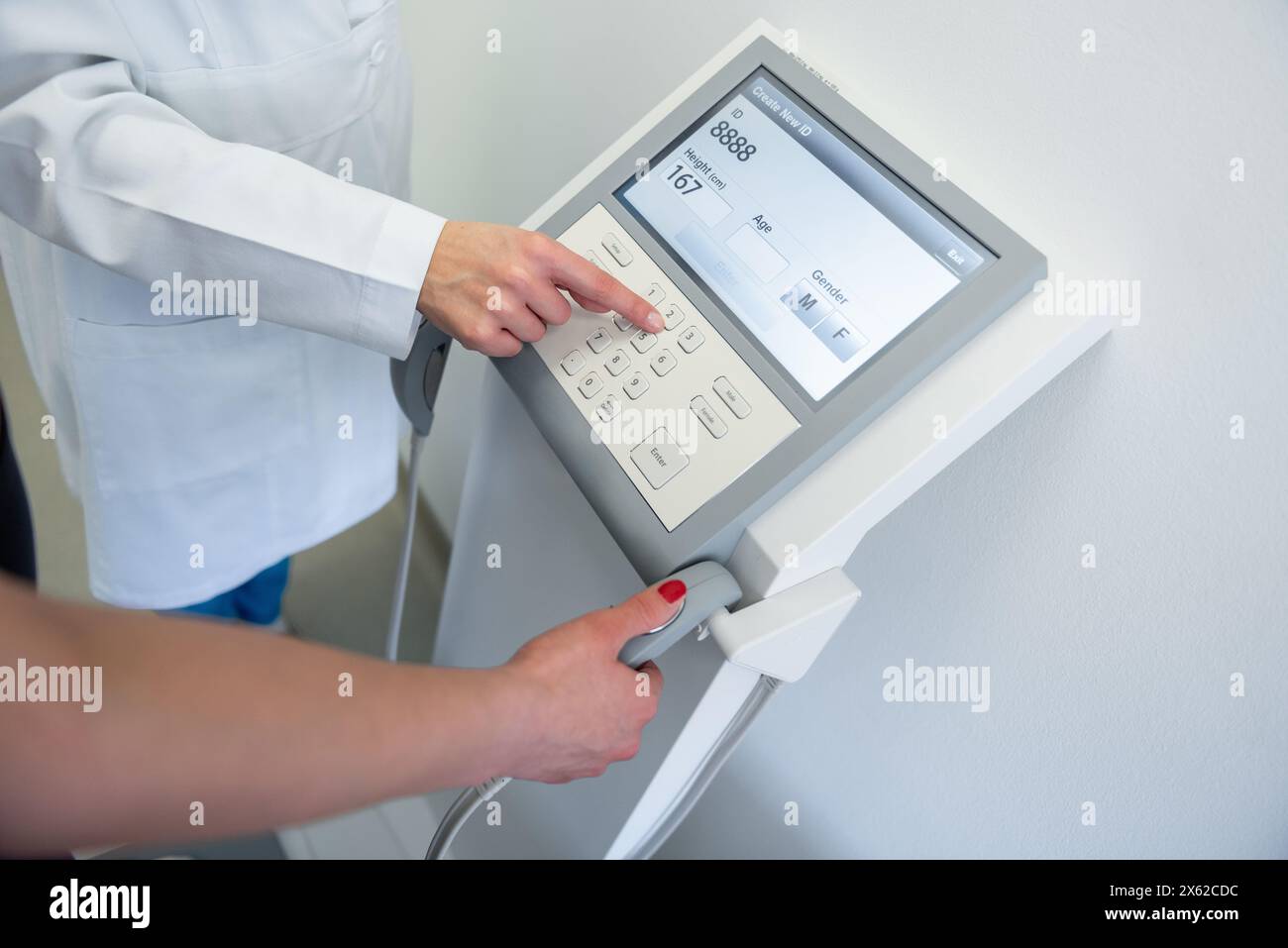 Female doctor measuring patient’s body composition with advanced ...