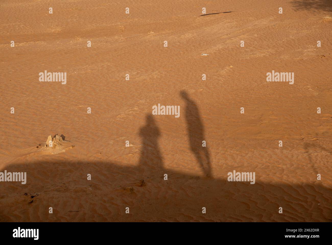 David and Goliath wandering in the desert Stock Photo - Alamy