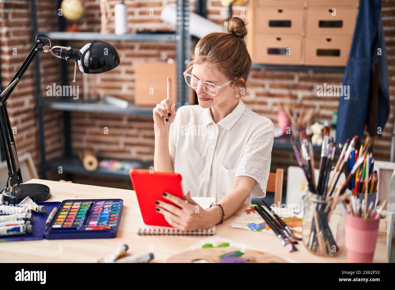 Excited young blonde artist hi-res stock photography and images - Alamy