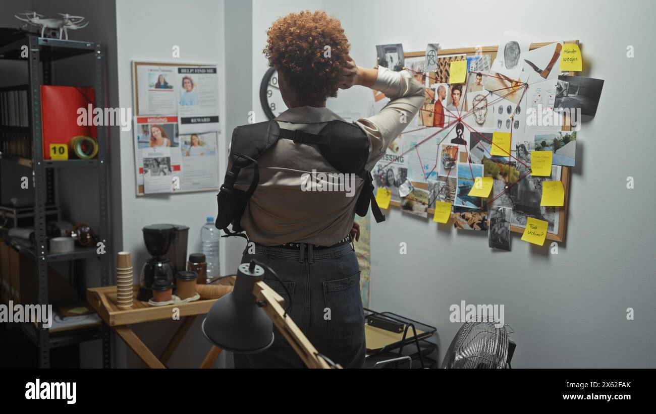 African american woman detective analyzing evidence board inside police ...