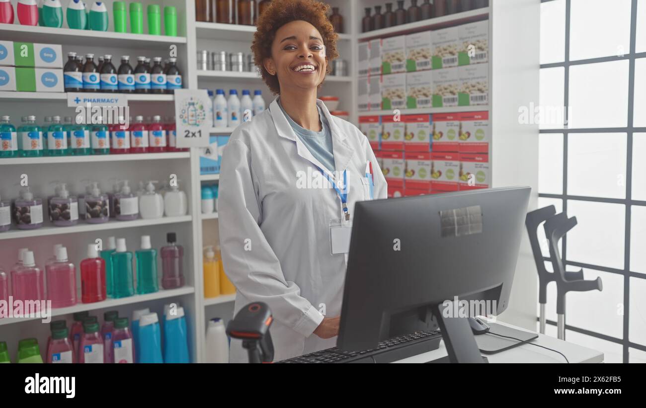 A smiling african american woman pharmacist standing in a pharmacy with ...