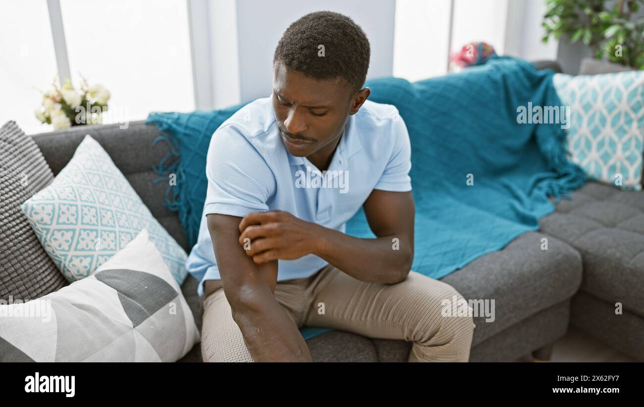 Man scratching arm hi-res stock photography and images - Alamy