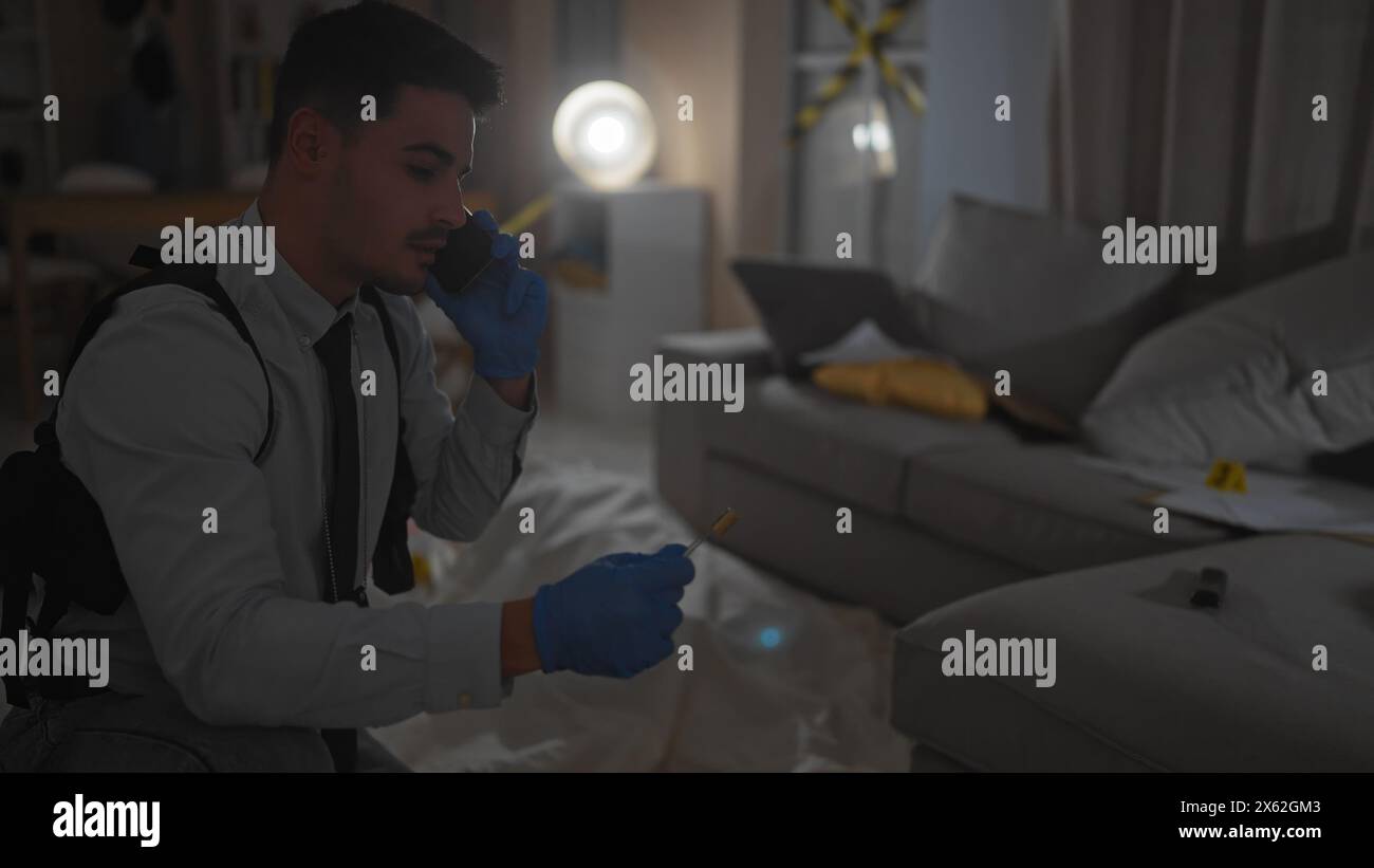 Young hispanic man examines evidence at an indoor crime scene while ...