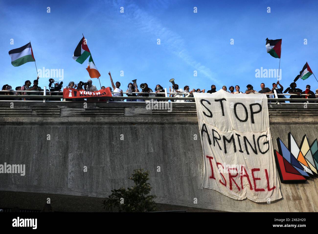 Protesters drop a banner from the side of Waterloo Bridge saying ’Stop ...