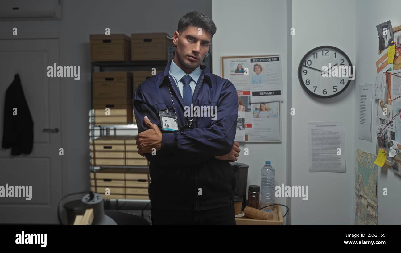 Hispanic detective with arms crossed standing in a cluttered police ...