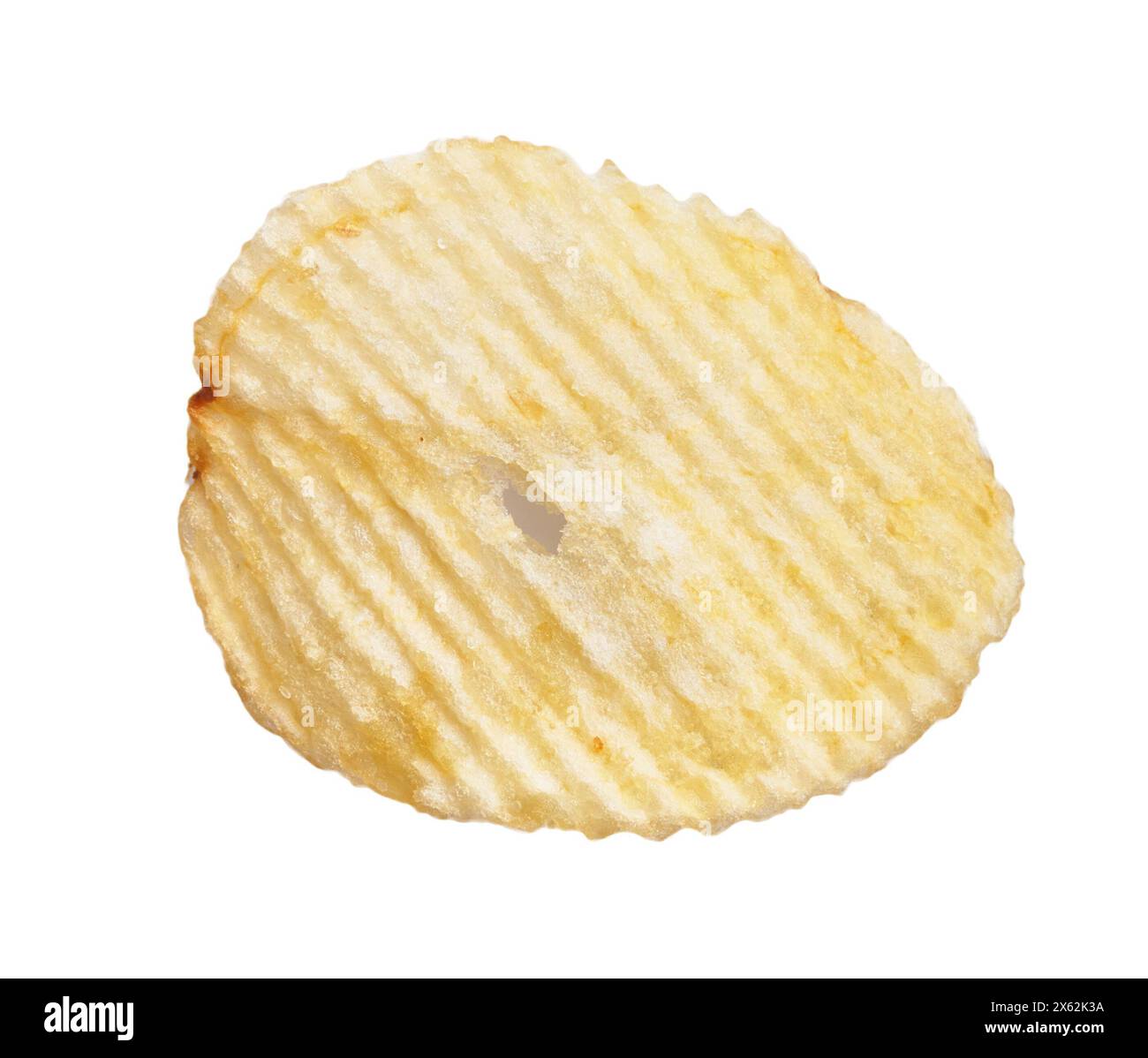 Single ridged potato chip isolated on a white background illustrates ...