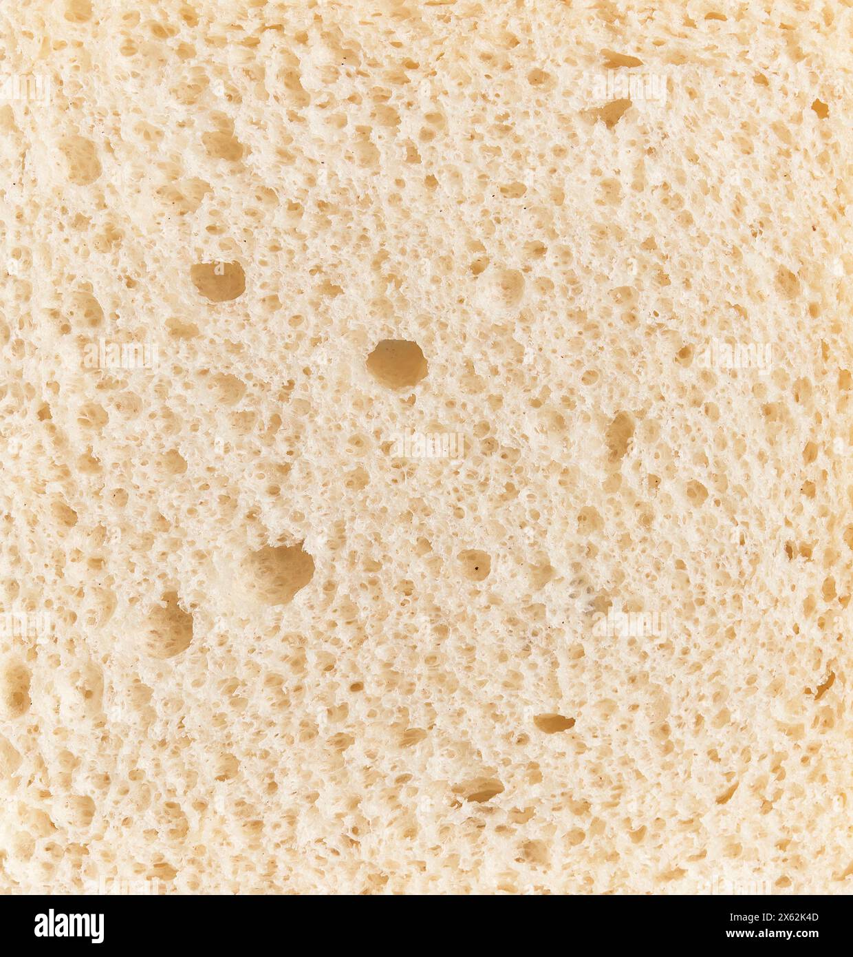 Close-up texture of white bread showing detailed porous structure ...
