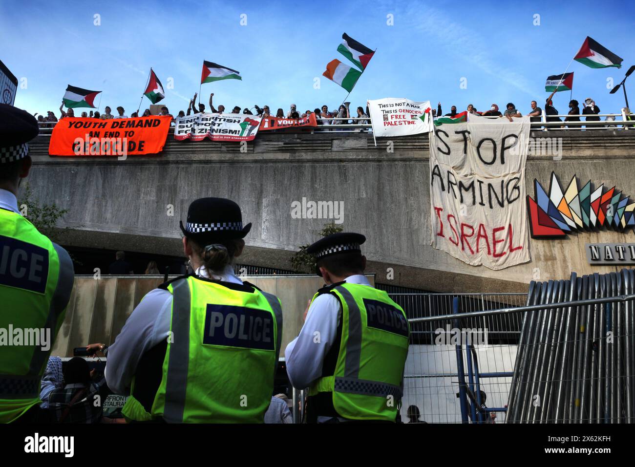 London, UK. 11th May, 2024. Protesters drop a banner from the side of ...