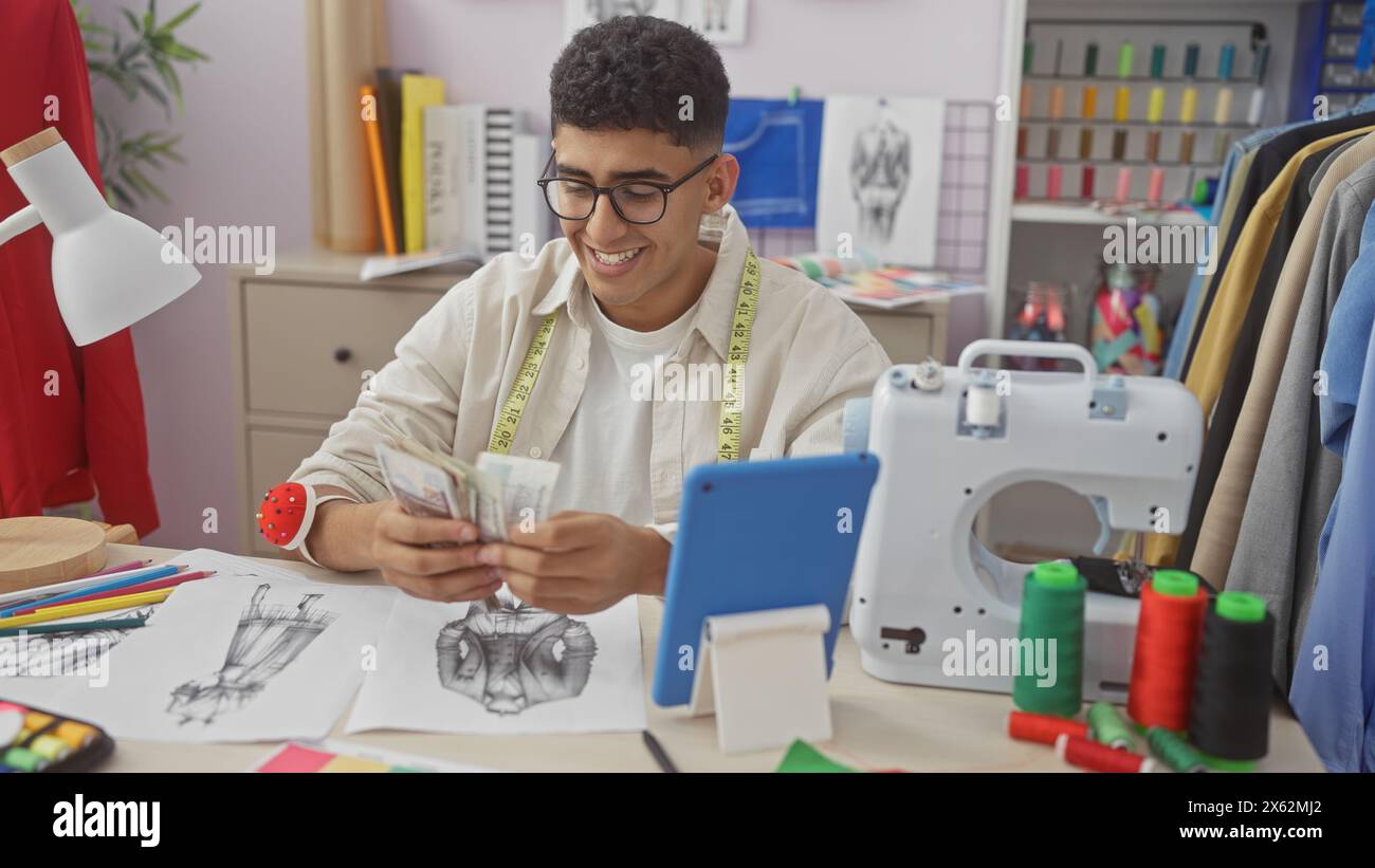 Smiling young man in tailor shop counting egyptian pounds at ...