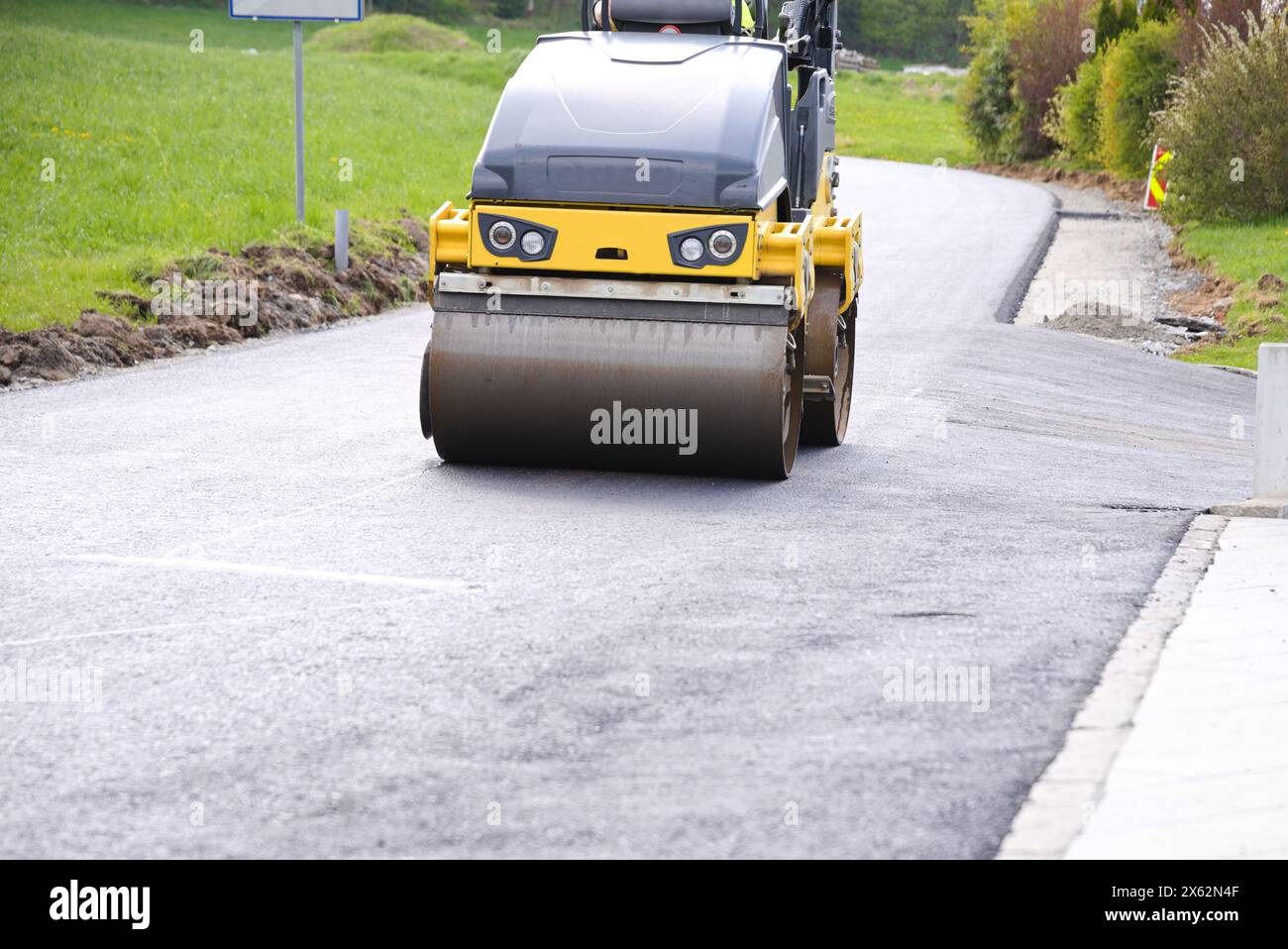 Compacting A Freshly Asphalted Road With Vibration Using A Road Roller ...