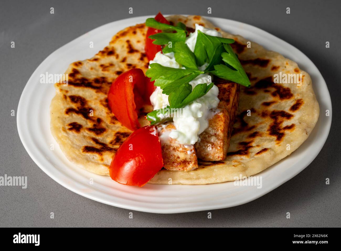 Greek gyro with grilled salmon, above shot Stock Photo - Alamy