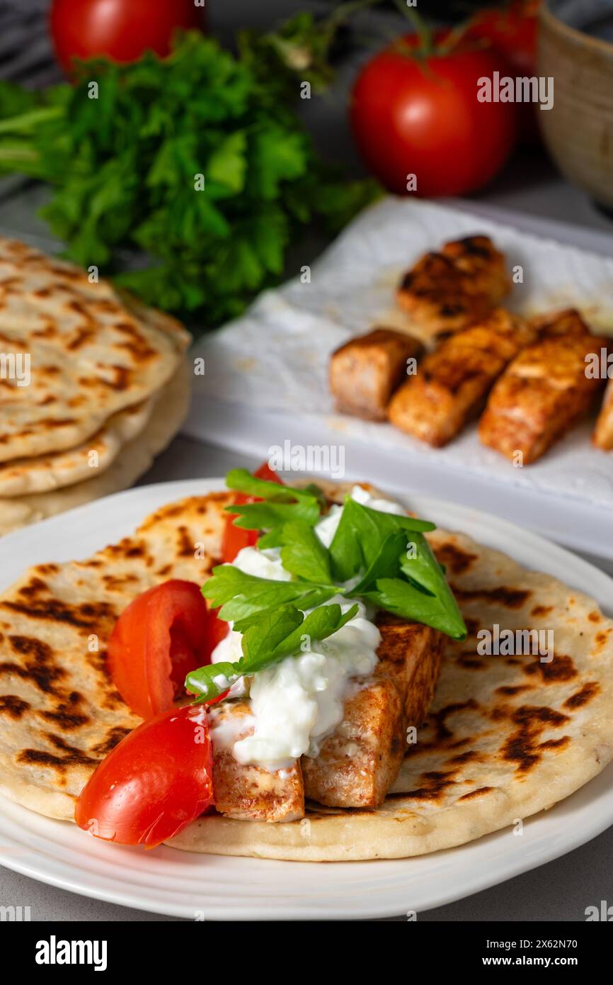 Greek gyro with grilled salmon, above shot Stock Photo - Alamy