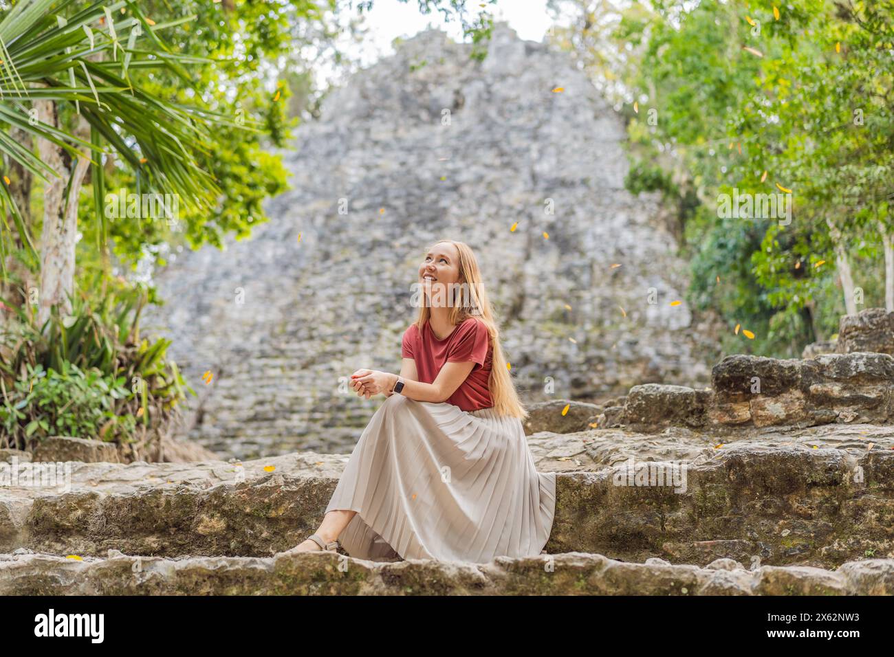 Woman tourist at Coba, Mexico. Ancient mayan city in Mexico. Coba is an archaeological area and ...