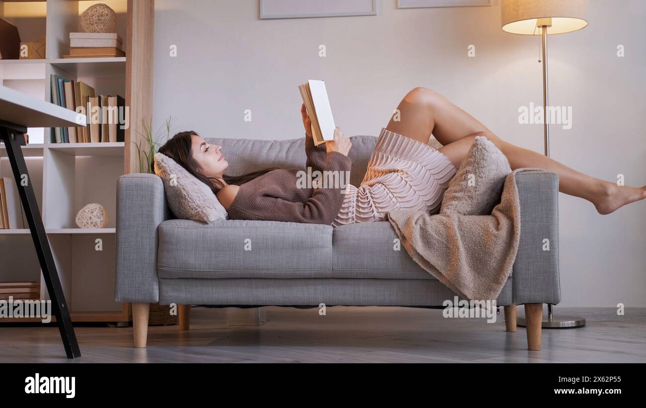 Interesting book. Relaxed leisure. Enjoying weekend. Smiling inspired ...