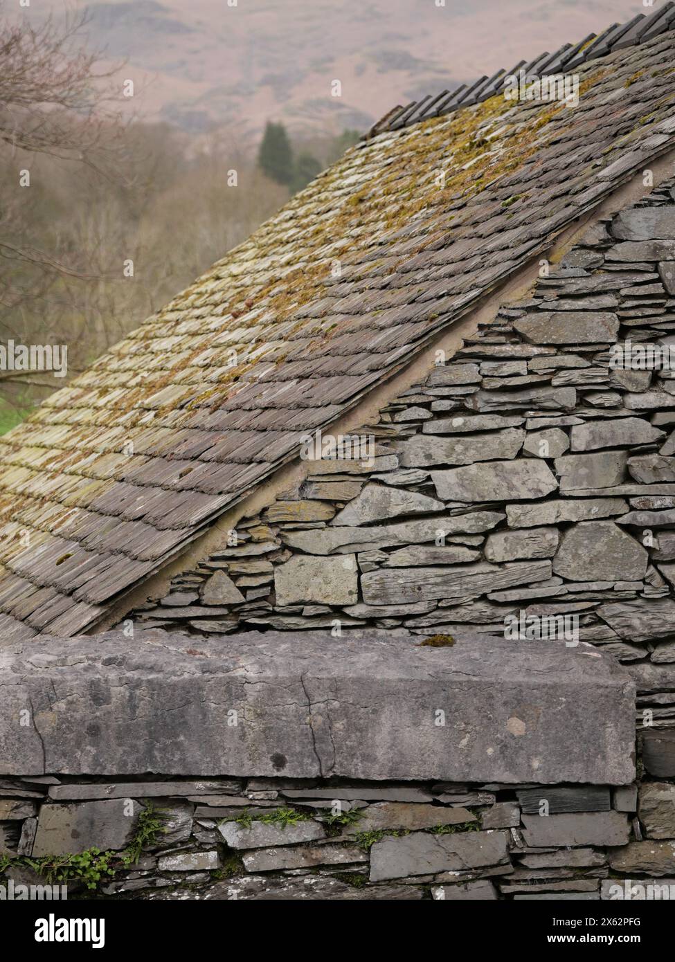 Traditional slate stone wall building detail of a Lake District house ...