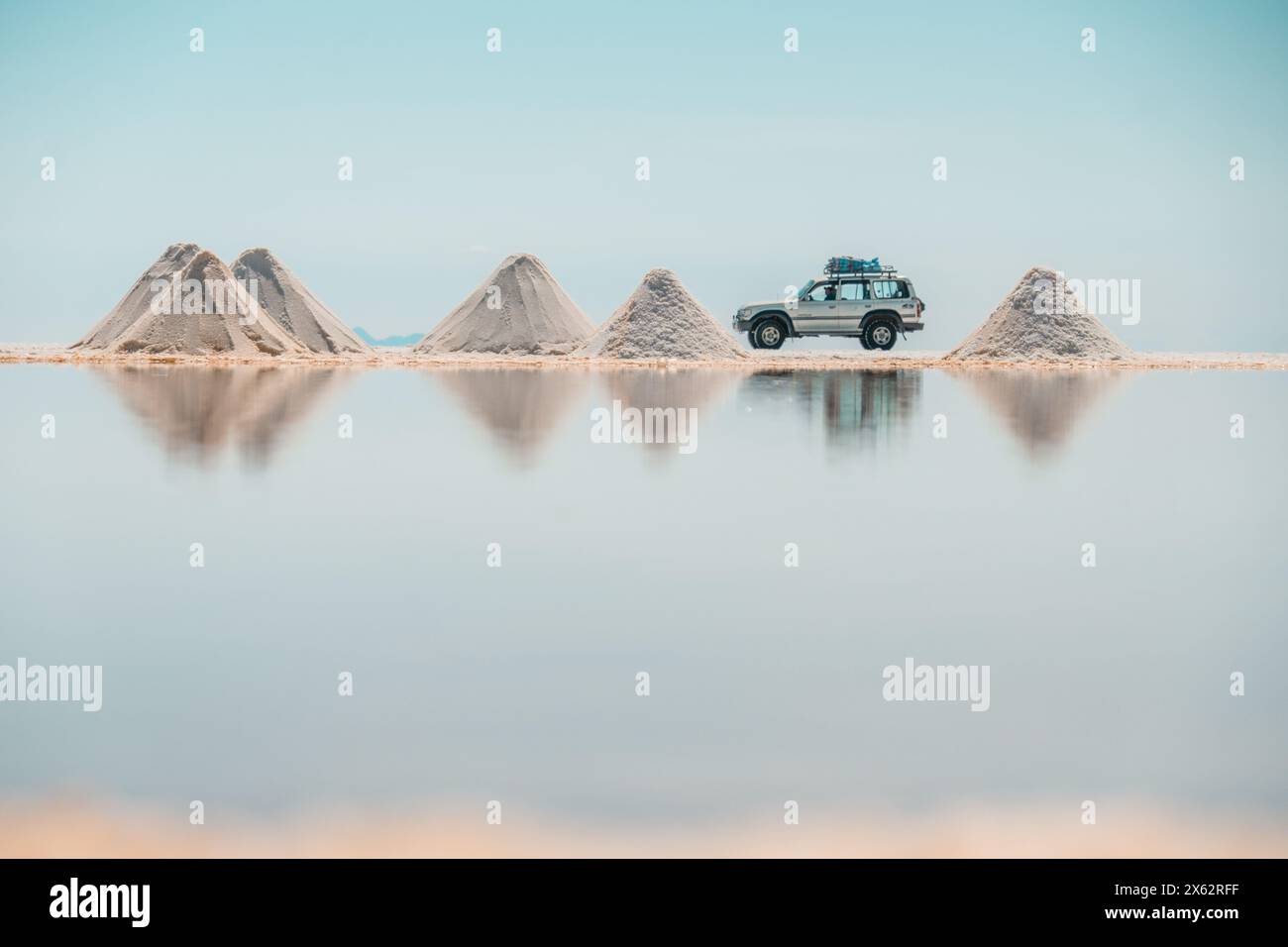 Salar de Uyuni (Uyuni salt flats) flags of the world - reflection. High ...