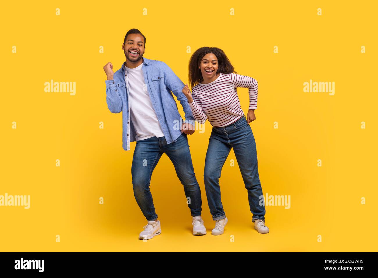 Woman dancing in front yellow hi-res stock photography and images - Alamy
