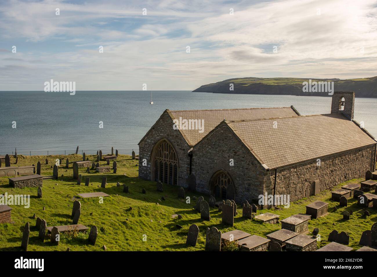 St. Hywyn's Church, Aberdaron, Wales in evening sunlight. An important ...