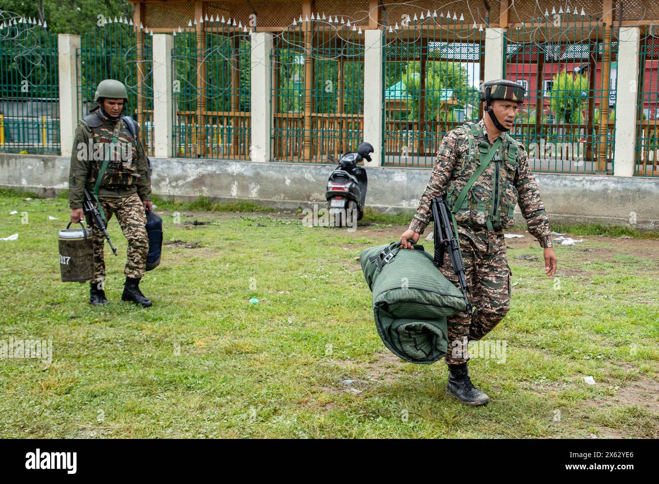 Srinagar, India. 12th May, 2024. Indian paramilitary troopers walk to a ...