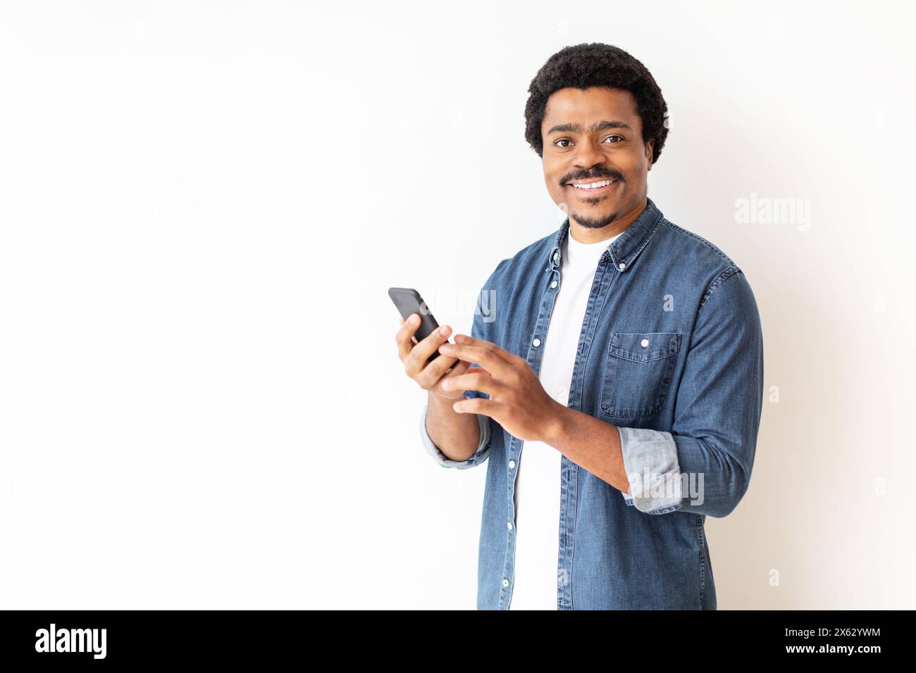 Man scrolling smartphone Cut Out Stock Images & Pictures - Alamy