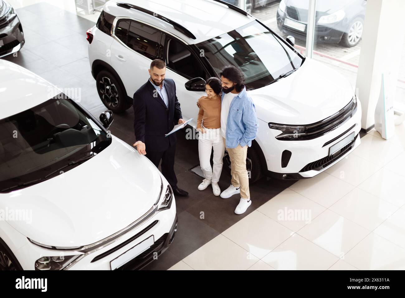 Professional car salesman presenting features hi-res stock photography ...