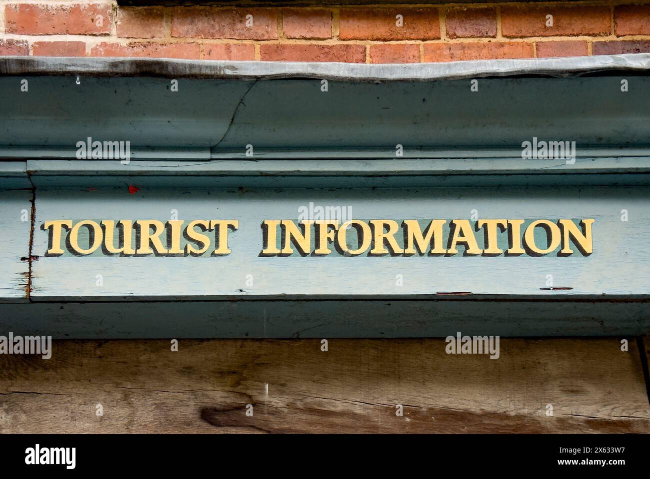 Hand-painted tourist information sign on a building exterior in ...