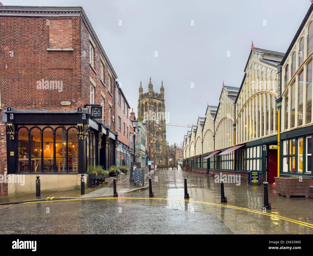 Stockport Market Hall with St Mary's Church in the distance on a grey ...