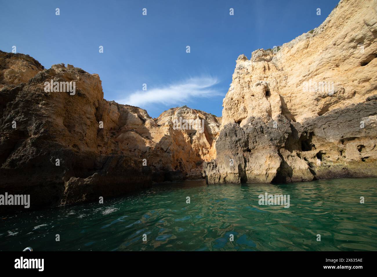 stunningly beautiful rocks in ocean near coast of Algarve in Portugal ...