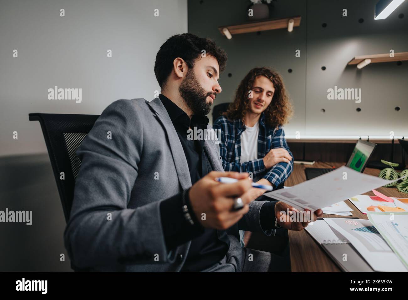 Collaborating colleagues in suits hi-res stock photography and images ...