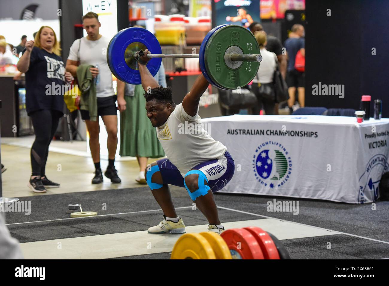 Weightlifter is seen in action at the Melbourne Convention and ...