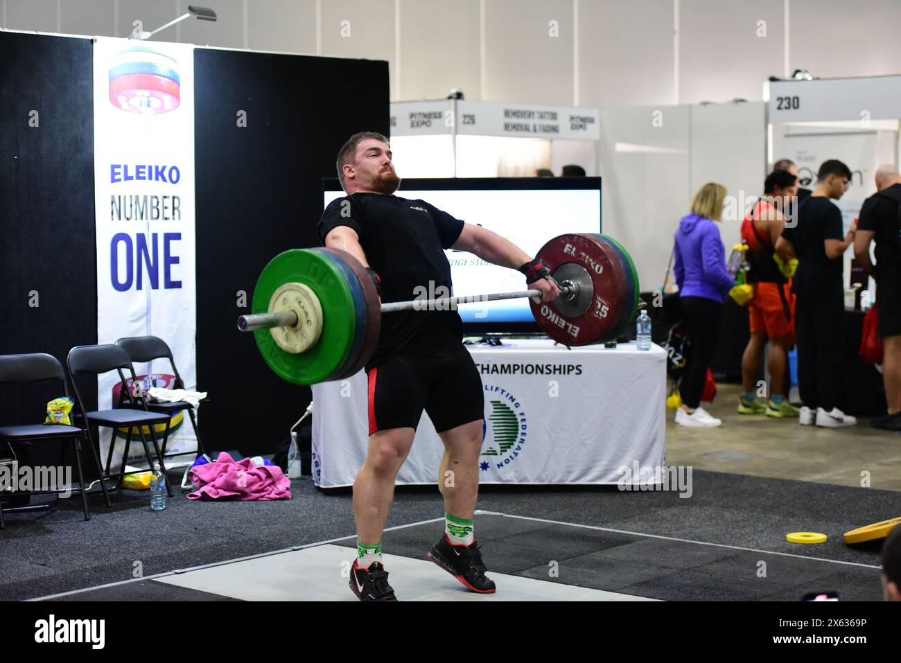 Australian weightlifter William Brown is seen in action at the ...