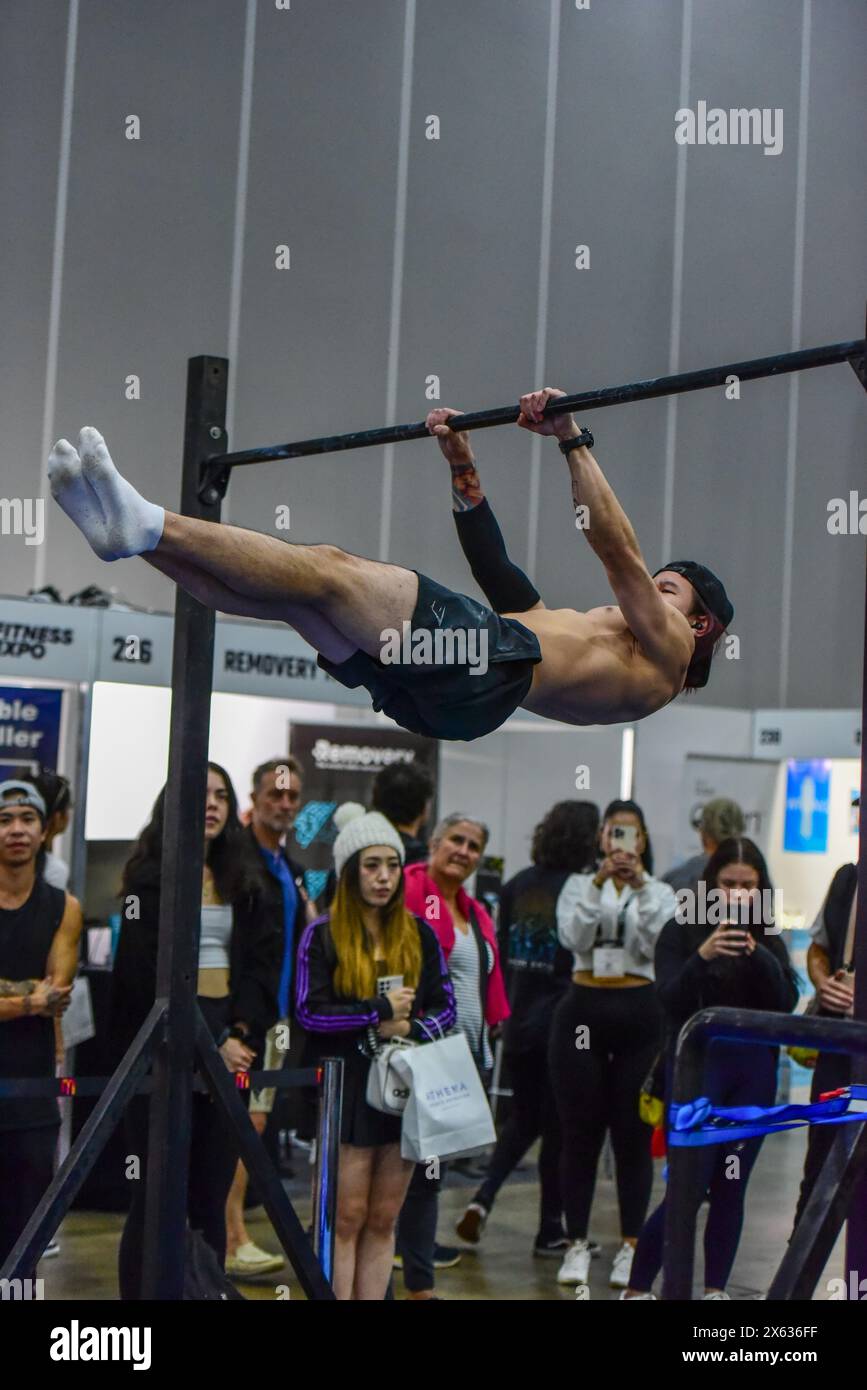 A competitor competes in Streetlifting Calisthenics Competition at the ...