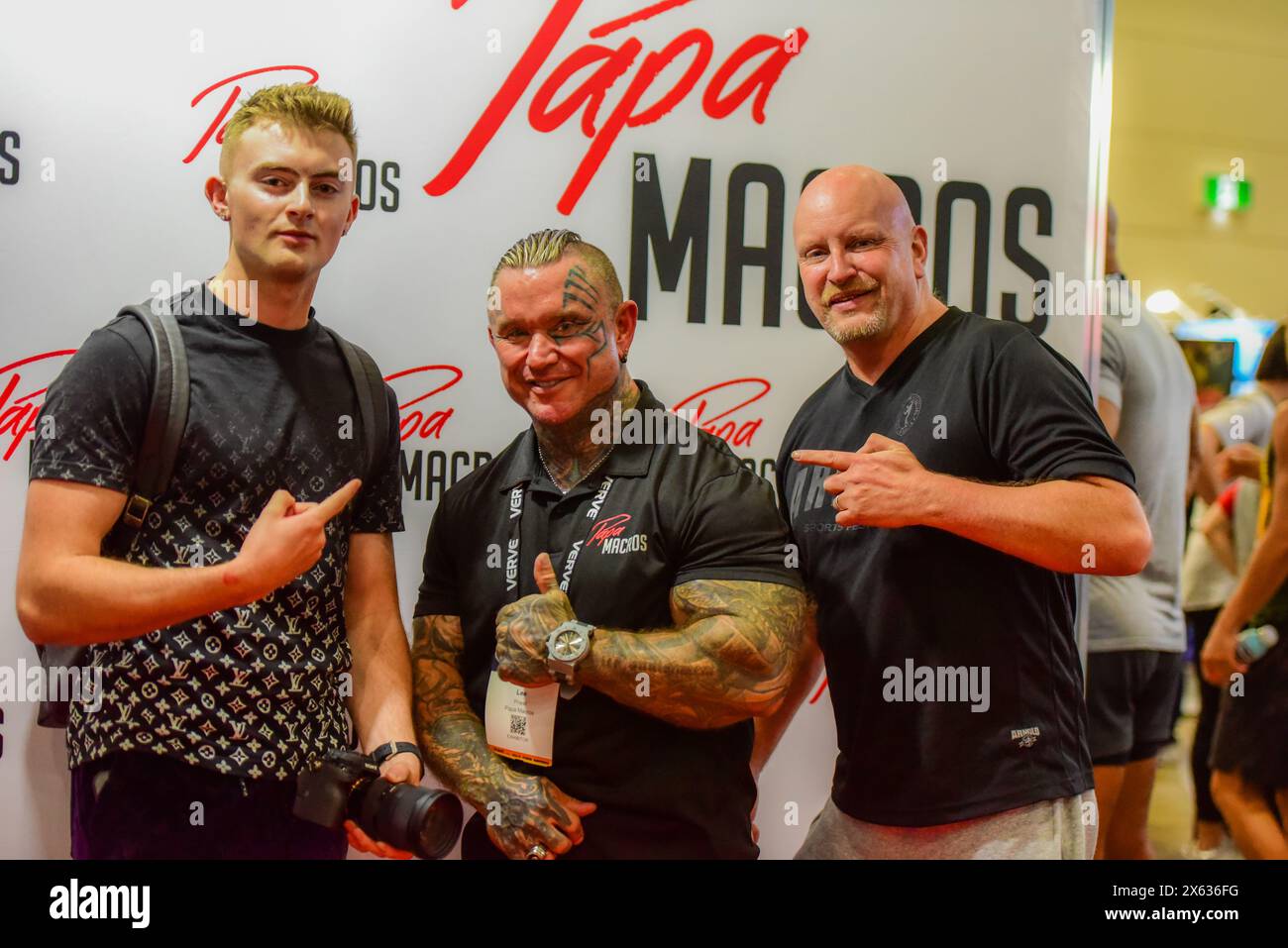 Expo visitors pose photos with bodybuilding legend Lee Priest at the ...